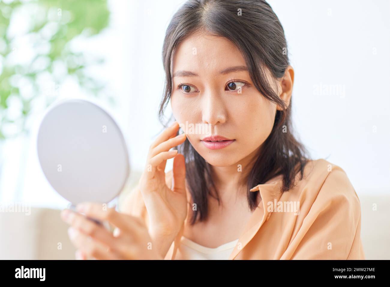 Unsatisfied woman looking mirror hi-res stock photography and images - Alamy
