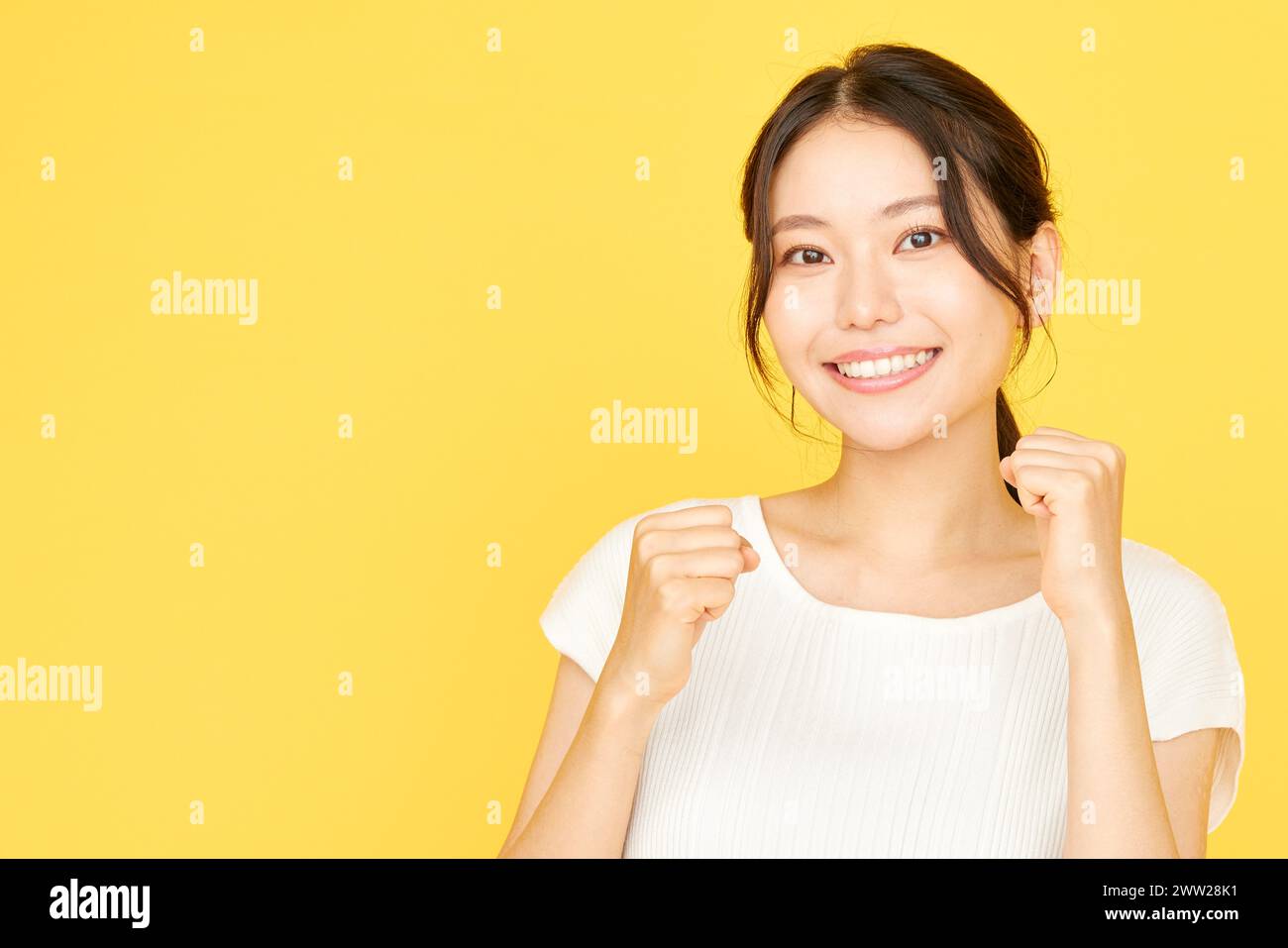 One smiling with clenched fist hi-res stock photography and images - Alamy
