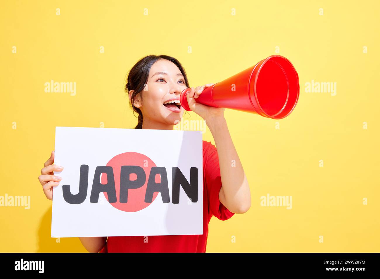 Japanese woman holding whiteboard and megaphone and cheering Stock ...
