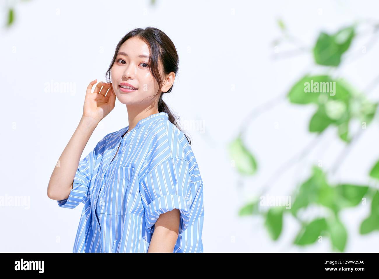 Woman in a blue shirt hi-res stock photography and images - Alamy