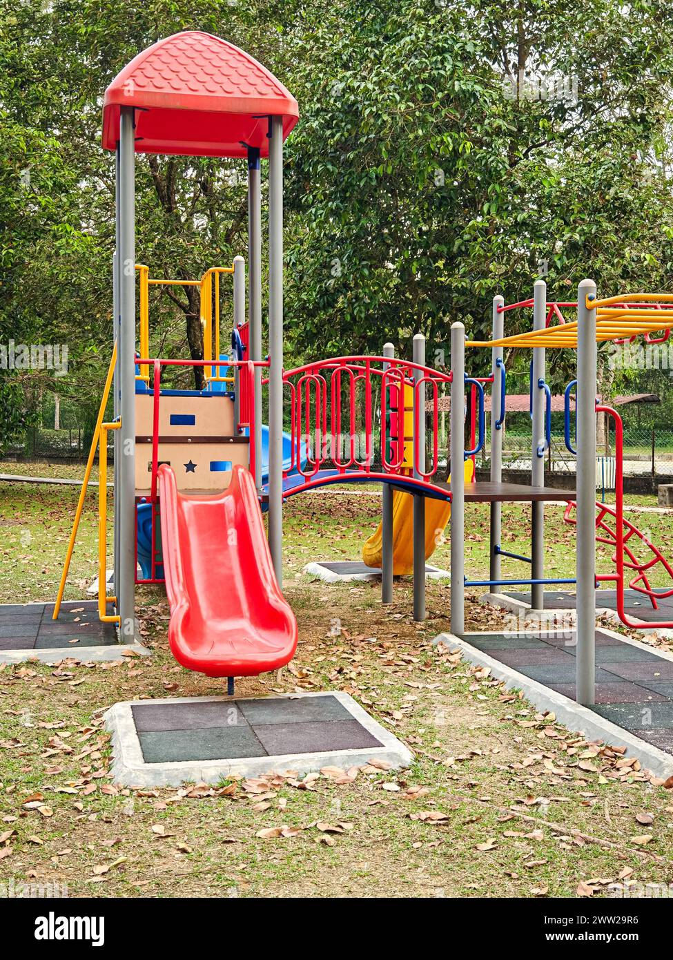 Colorful children playground with slides and steps Stock Photo - Alamy