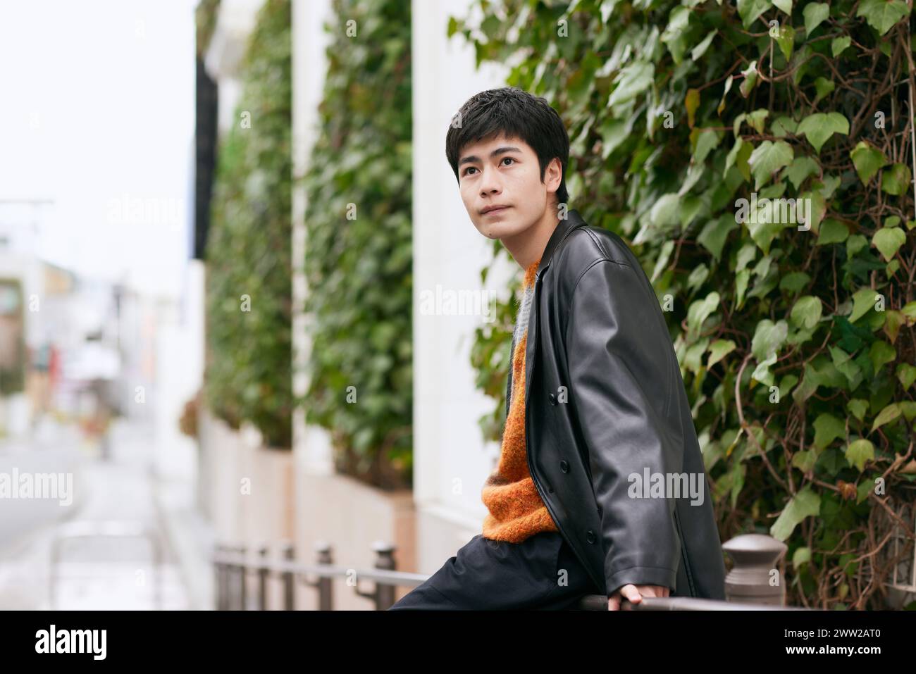 Man leather jacket leaning on hi-res stock photography and images - Alamy