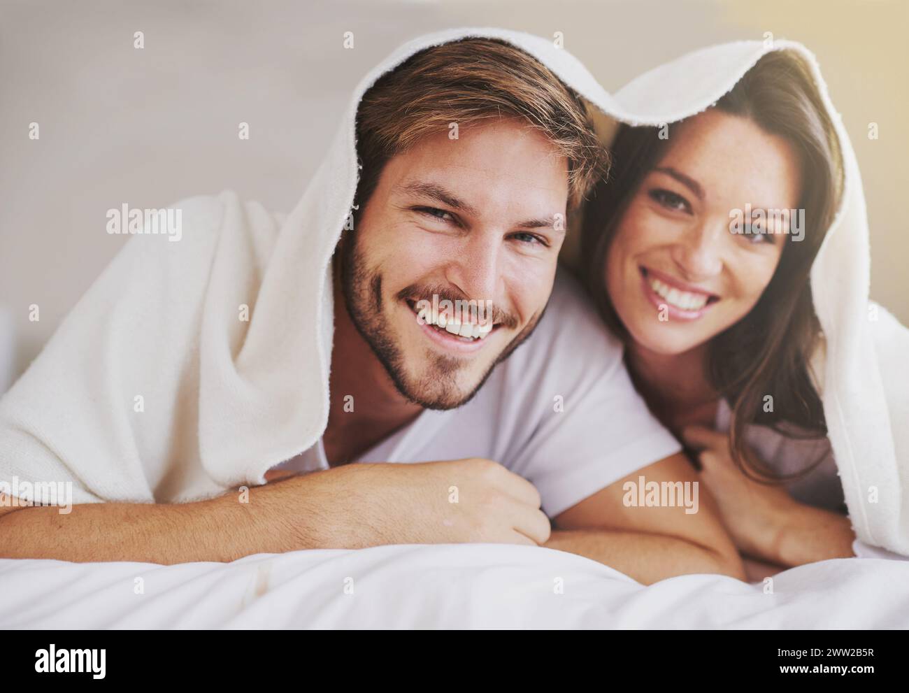 Married couple laying on bed hi-res stock photography and images - Alamy