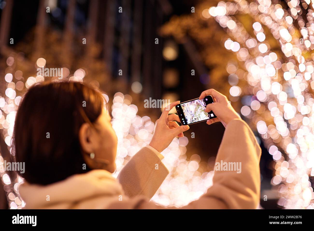 Woman taking photo christmas hi-res stock photography and images - Alamy