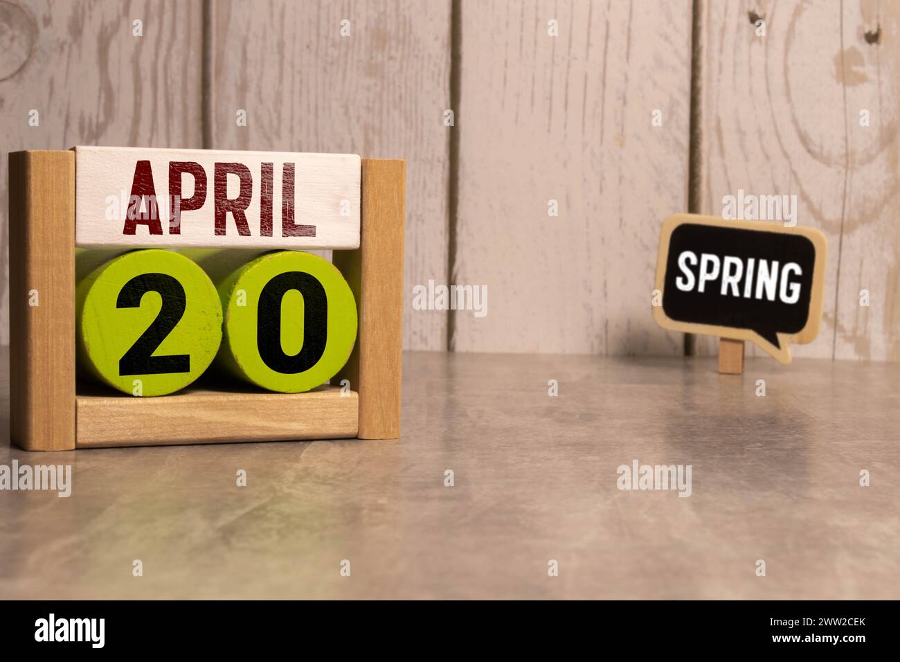 April 20th. Day 20 of april month, calendar on table with yellow ...