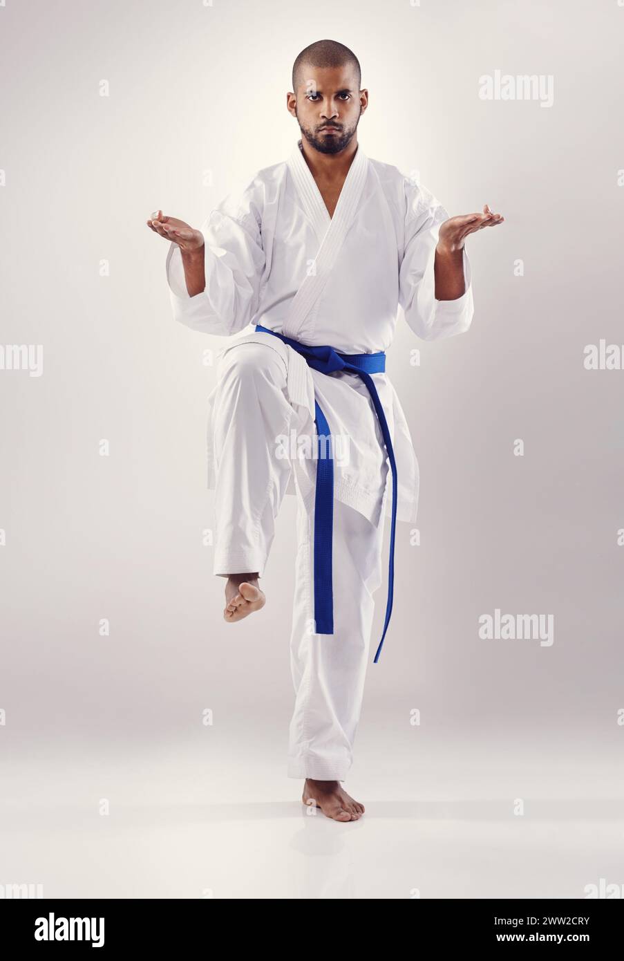 Studio, karate and African man training to improve physical health with ...