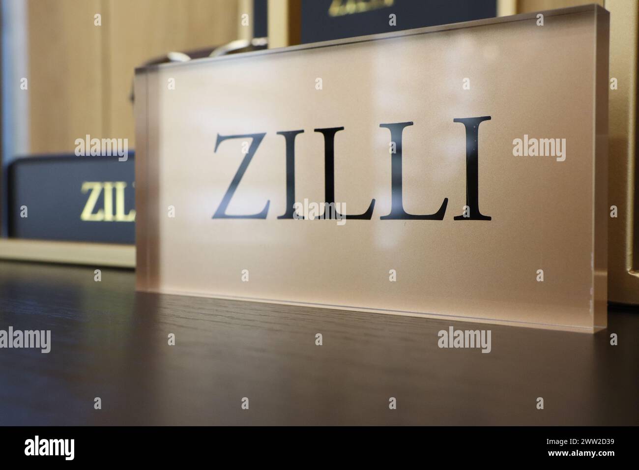 Rectangular glass block with zilli written in a wooden fixture Stock ...