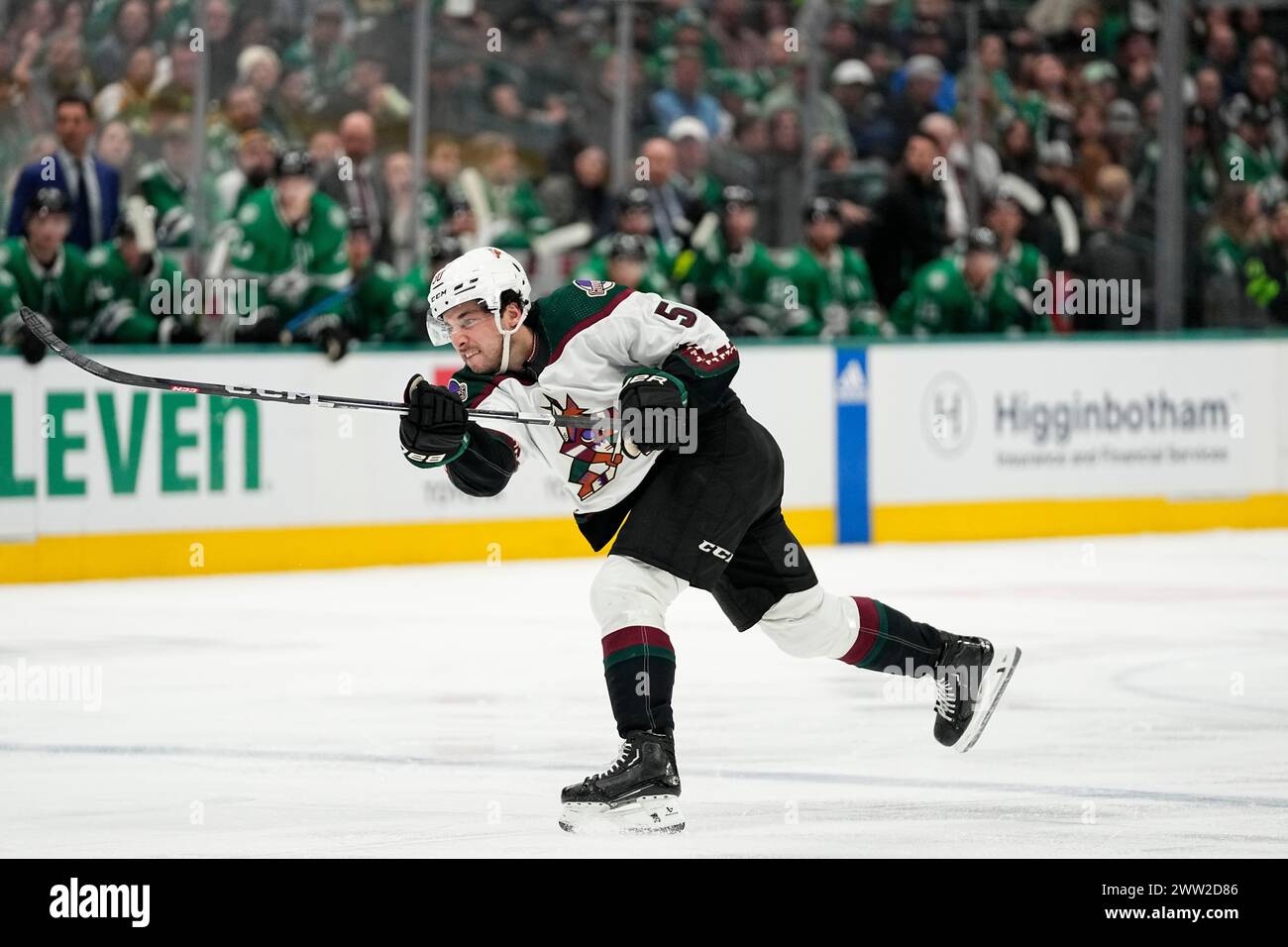 Arizona Coyotes defenseman Sean Durzi follows through on a shot during ...
