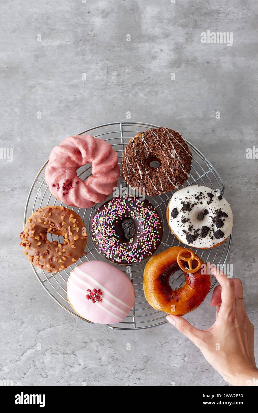 A group of donuts with different toppings Stock Photo - Alamy