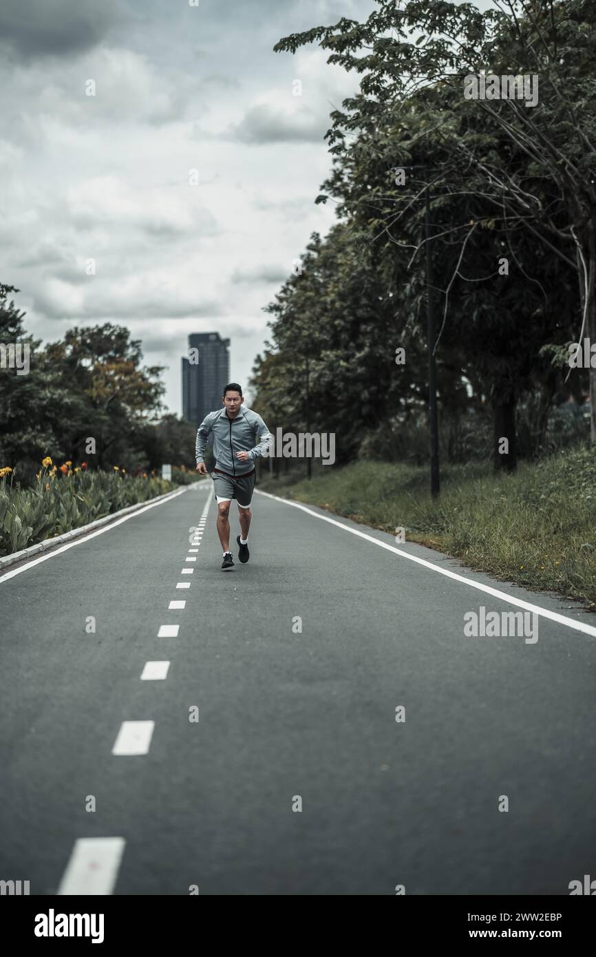 A man jogging in the city center park cardio workout, running. Health ...