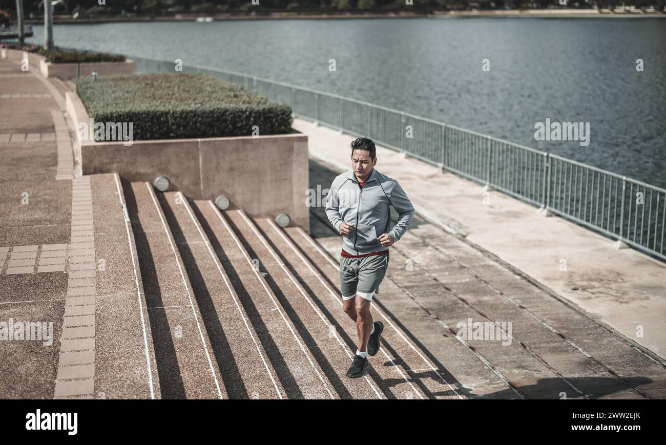 Man running up bridge stairs hi-res stock photography and images - Alamy
