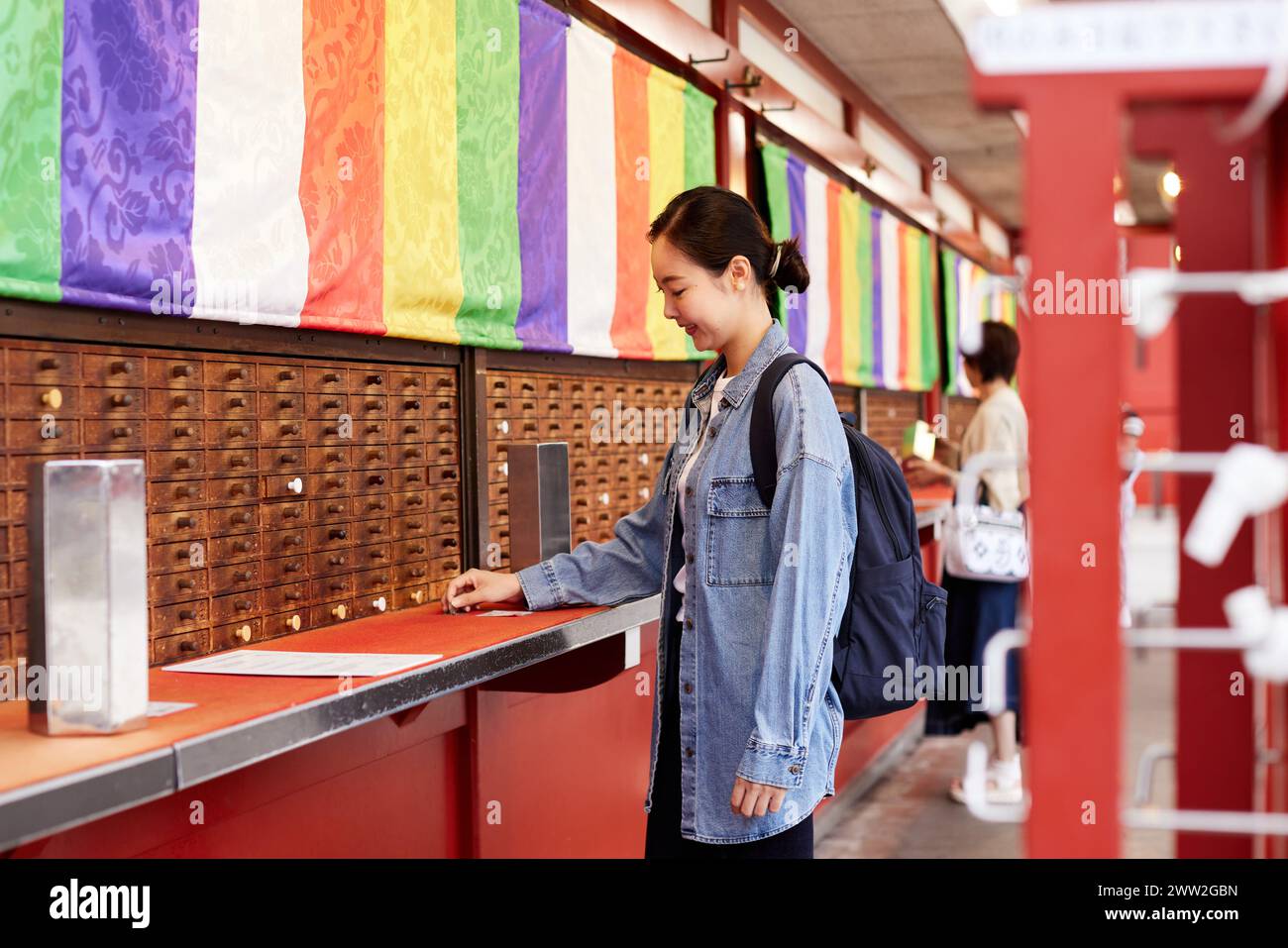 Asian woman at a temple Stock Photo - Alamy