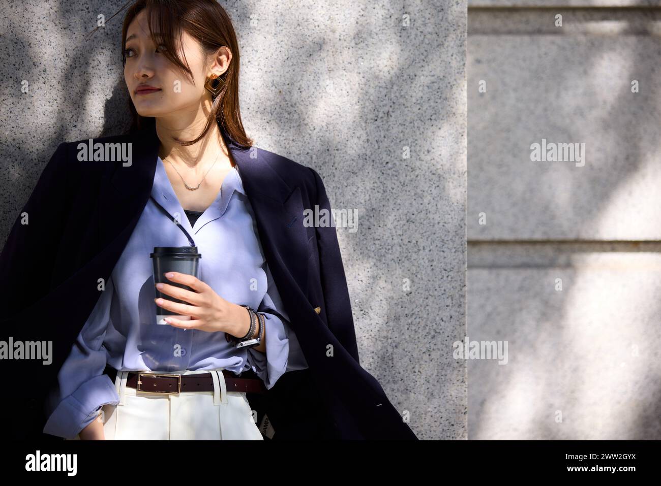 Woman in a blue shirt hi-res stock photography and images - Alamy