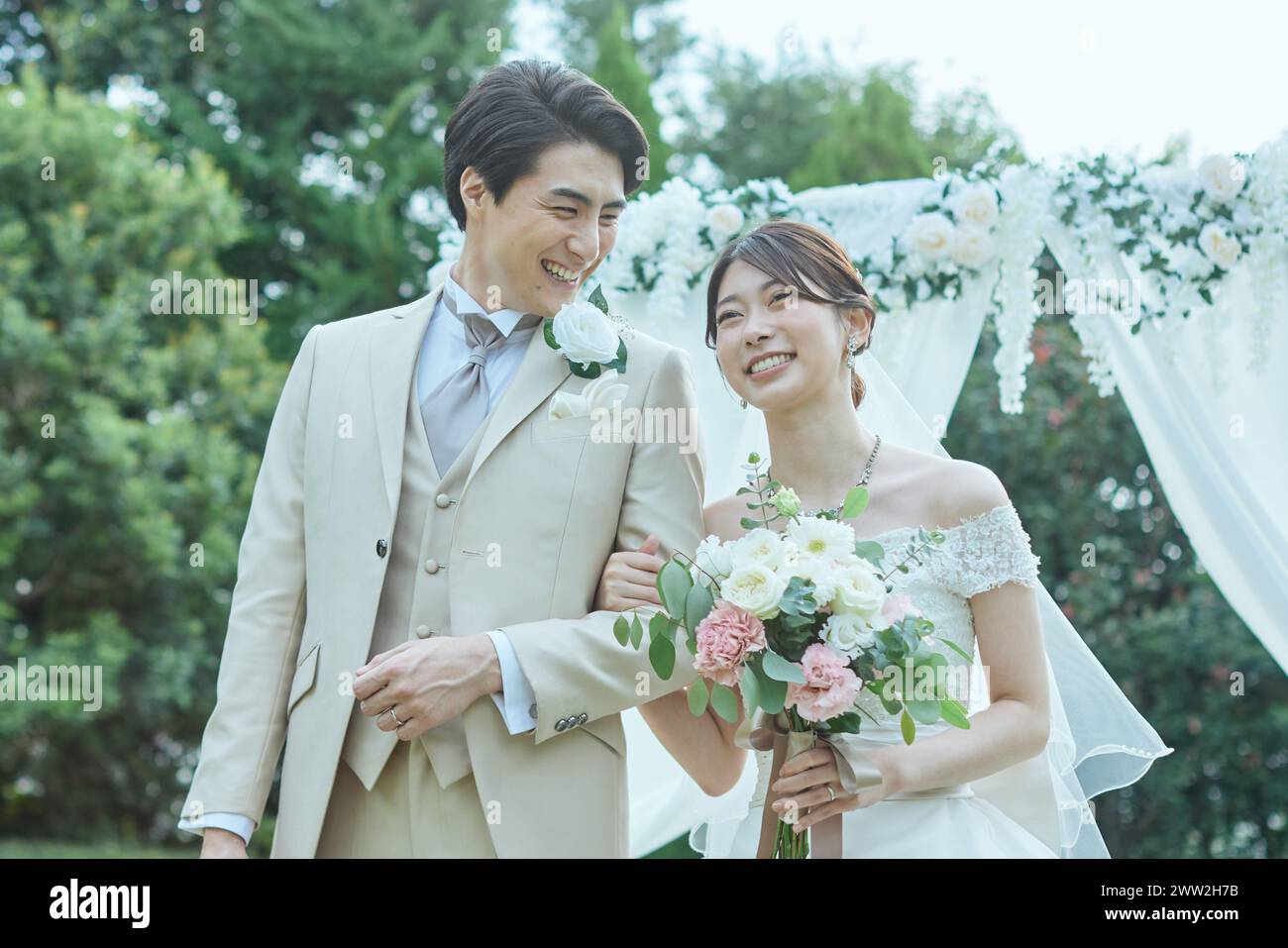Bride and groom standing next to each other Stock Photo - Alamy
