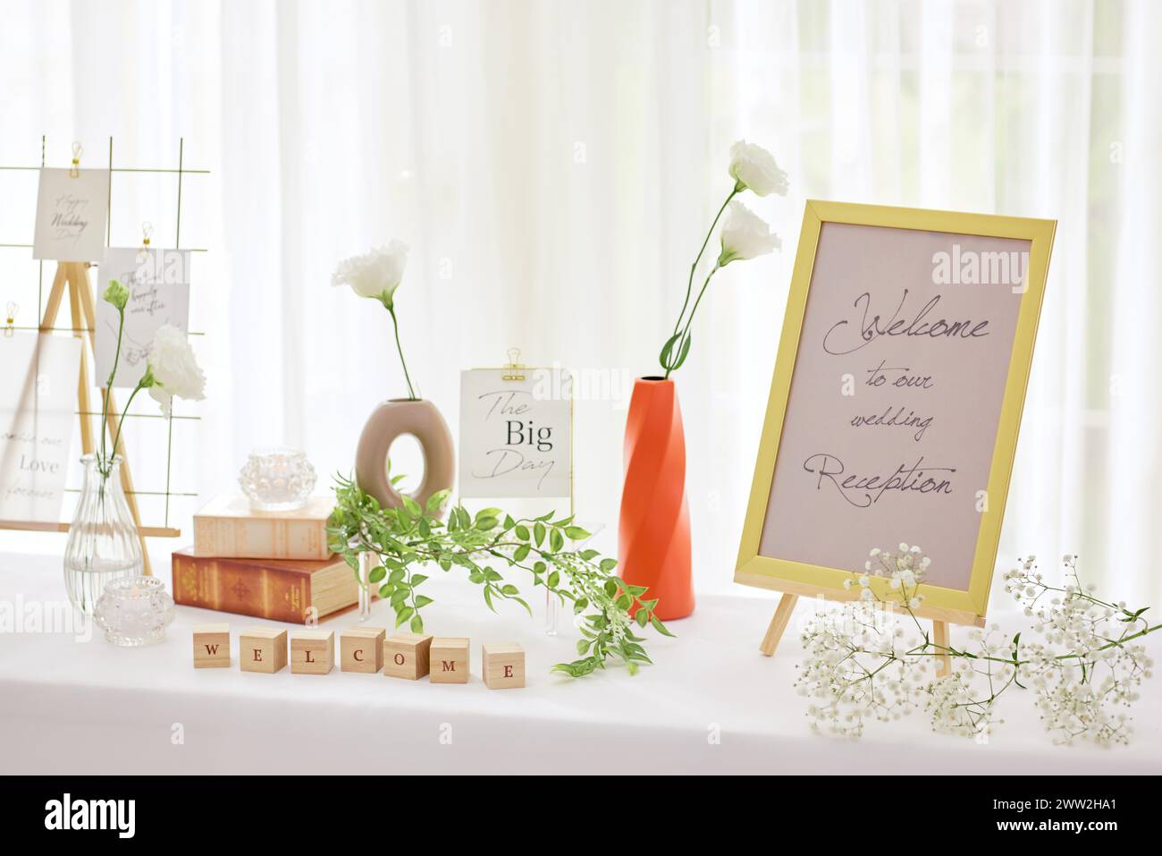 Wedding reception table with flowers and a welcome sign Stock Photo - Alamy