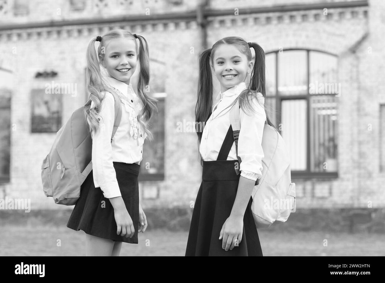 two teen schoolgirls together outdoor. school day Stock Photo - Alamy