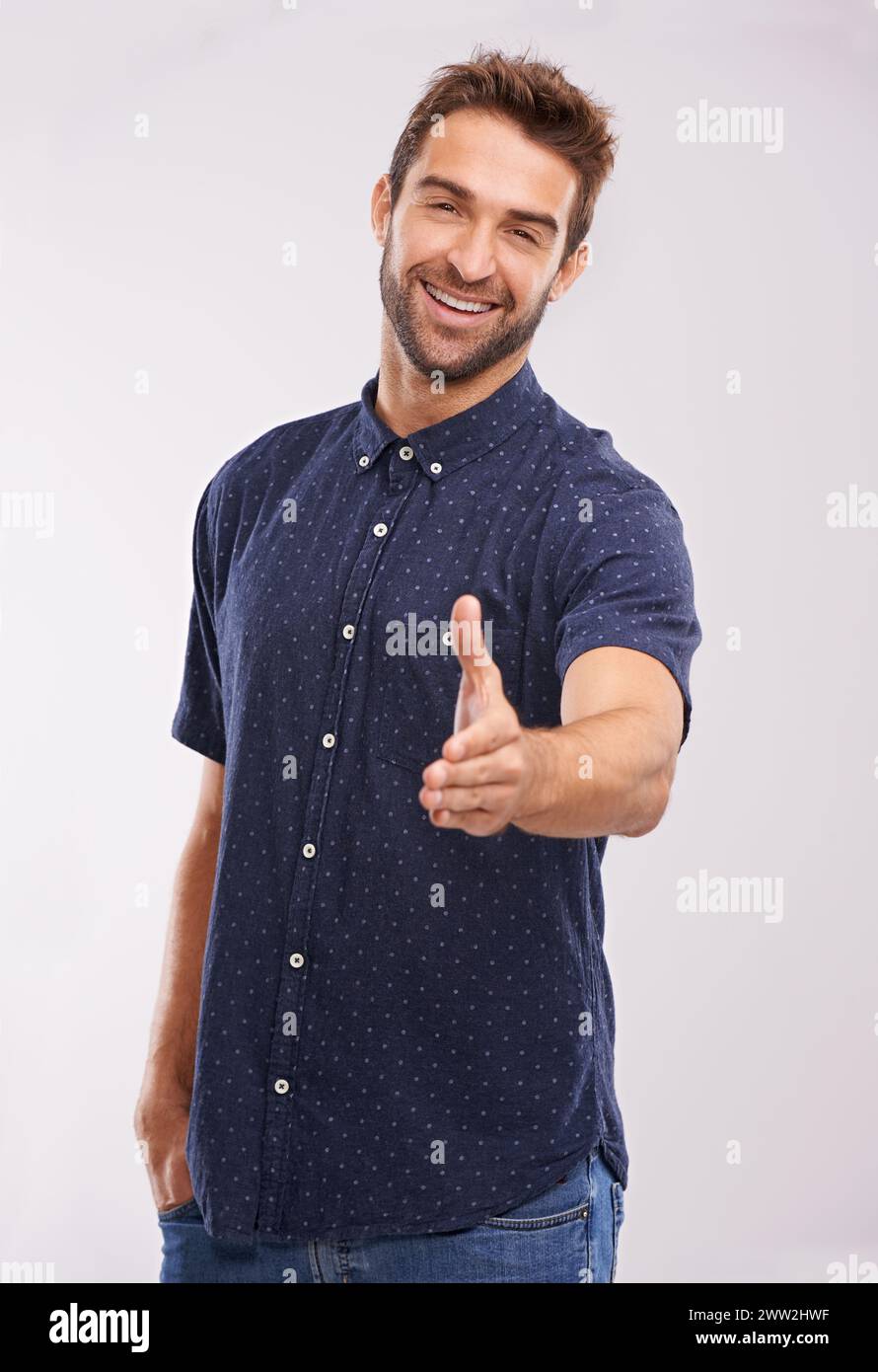Welcome, handshake and portrait of man in studio, background and ...