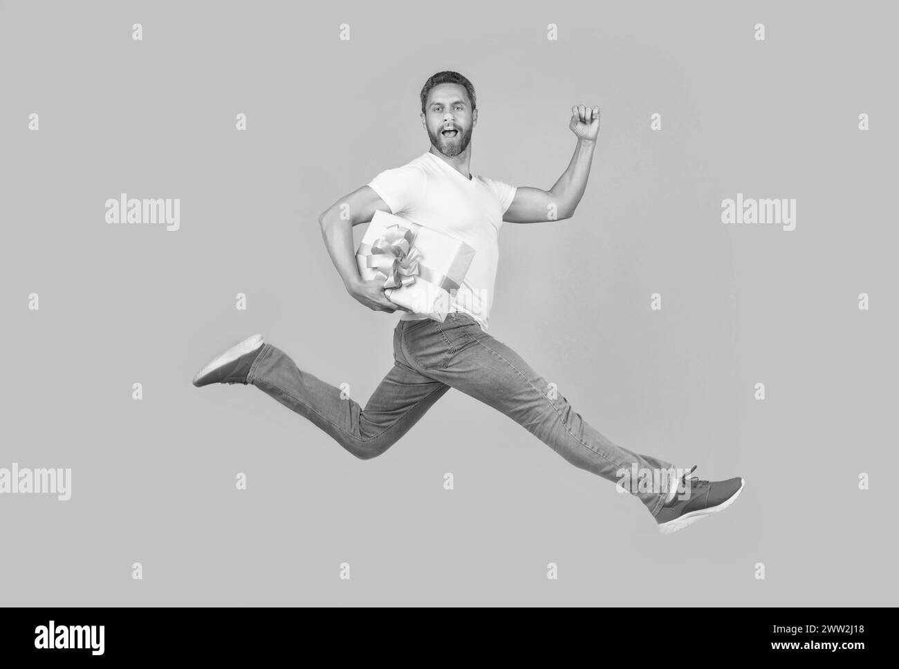 deliveryman in midair yellow background. deliveryman running fast with ...