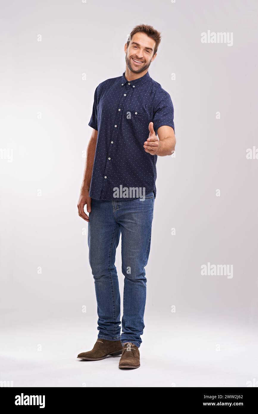 Welcome, handshake and portrait of man in studio, background and ...