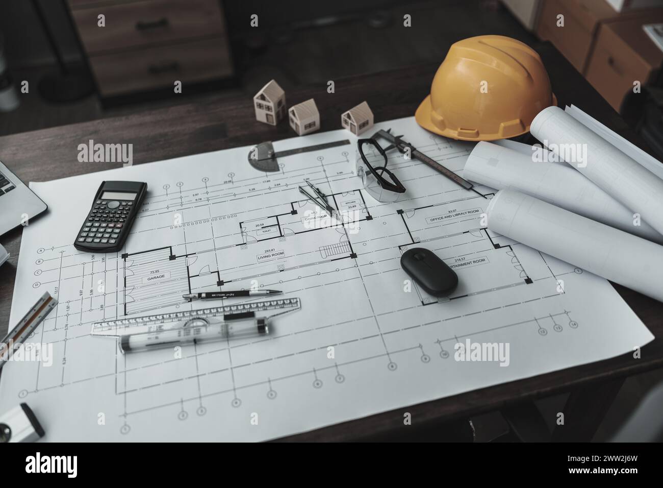 Mini model house, pencil, compass and roll blueprint plan on blueprint ...