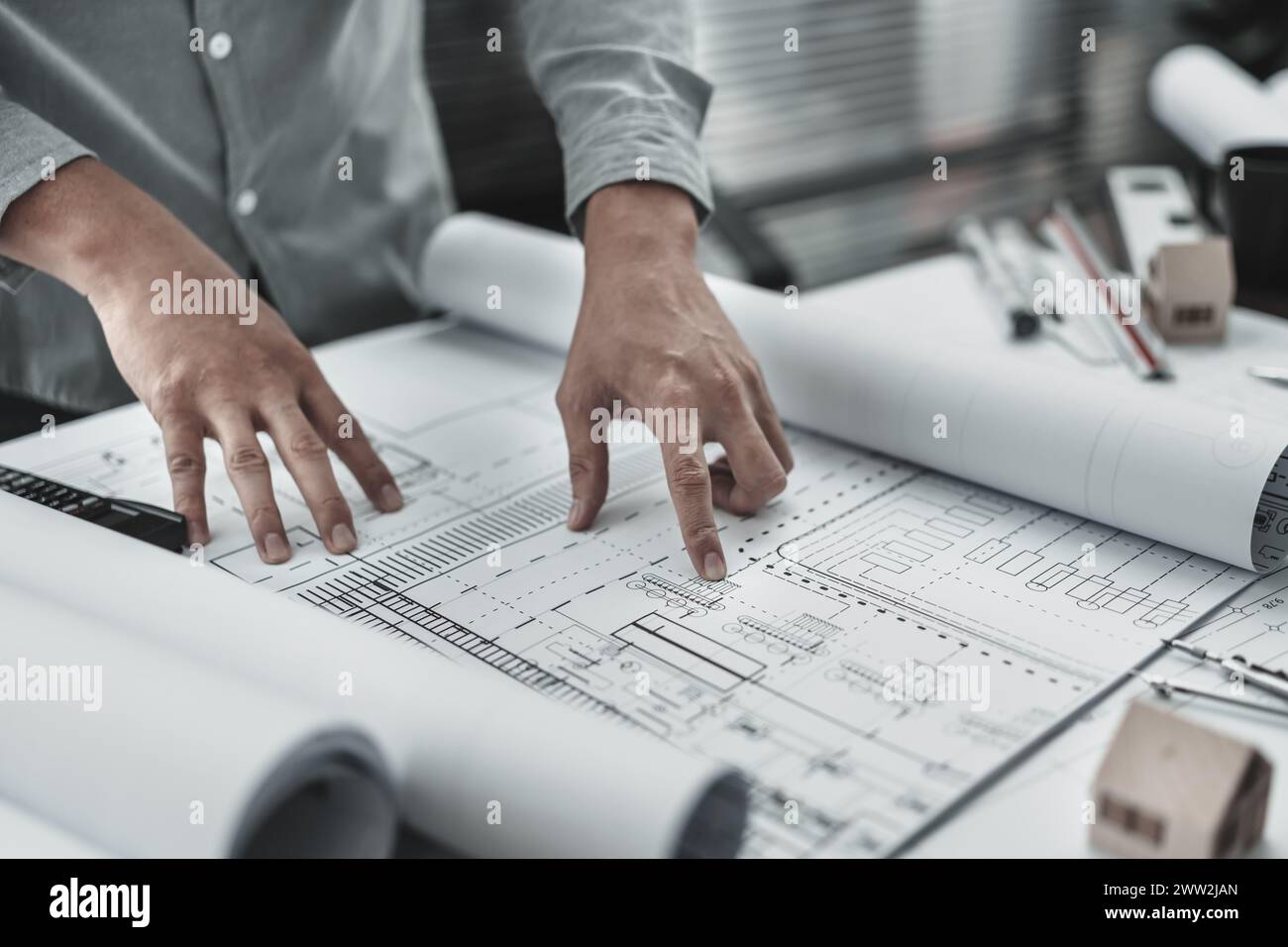 Architect engineer read drawing design working on blueprint. House ...