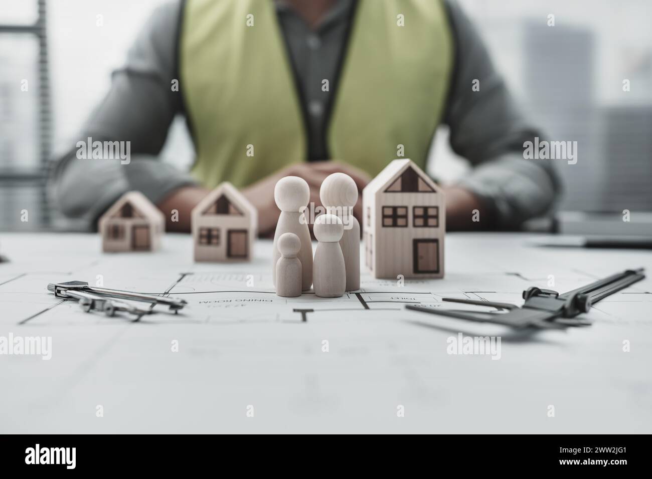 house model and wood doll repersent family on blueprint. Architect and ...