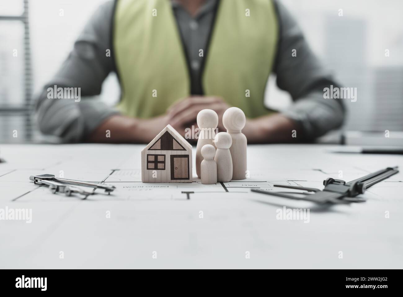 house model and wood doll repersent family on blueprint. Architect and ...