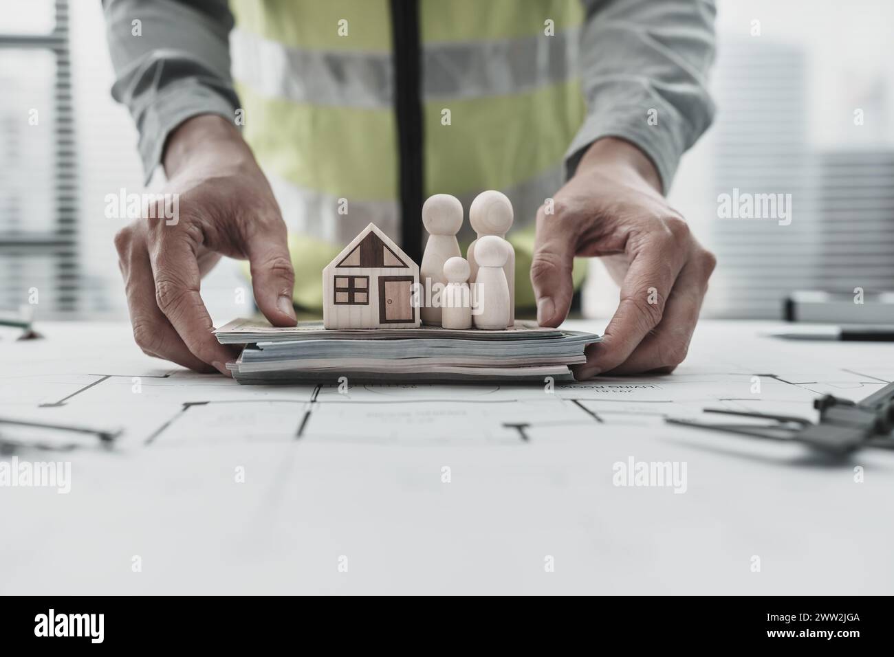 House model, wood doll and Moneys on house layout repersent family save ...