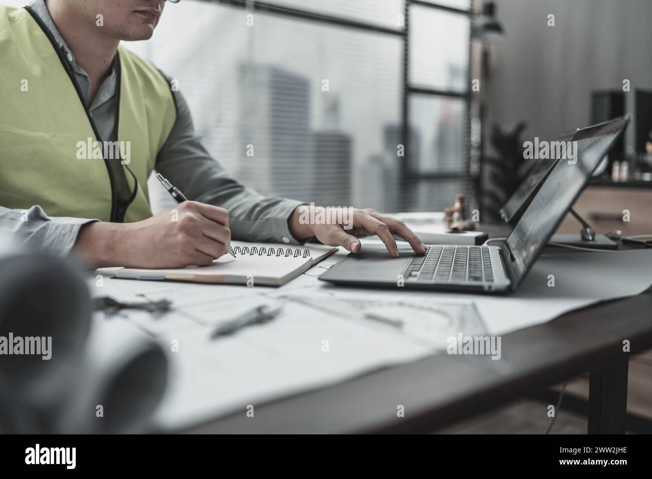Engineering working with laptop inspection on the office desk. Engineer ...