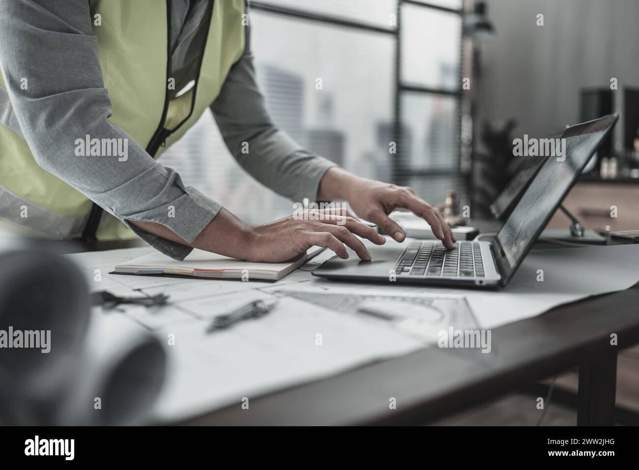 Engineering working with laptop inspection on the office desk. Engineer ...