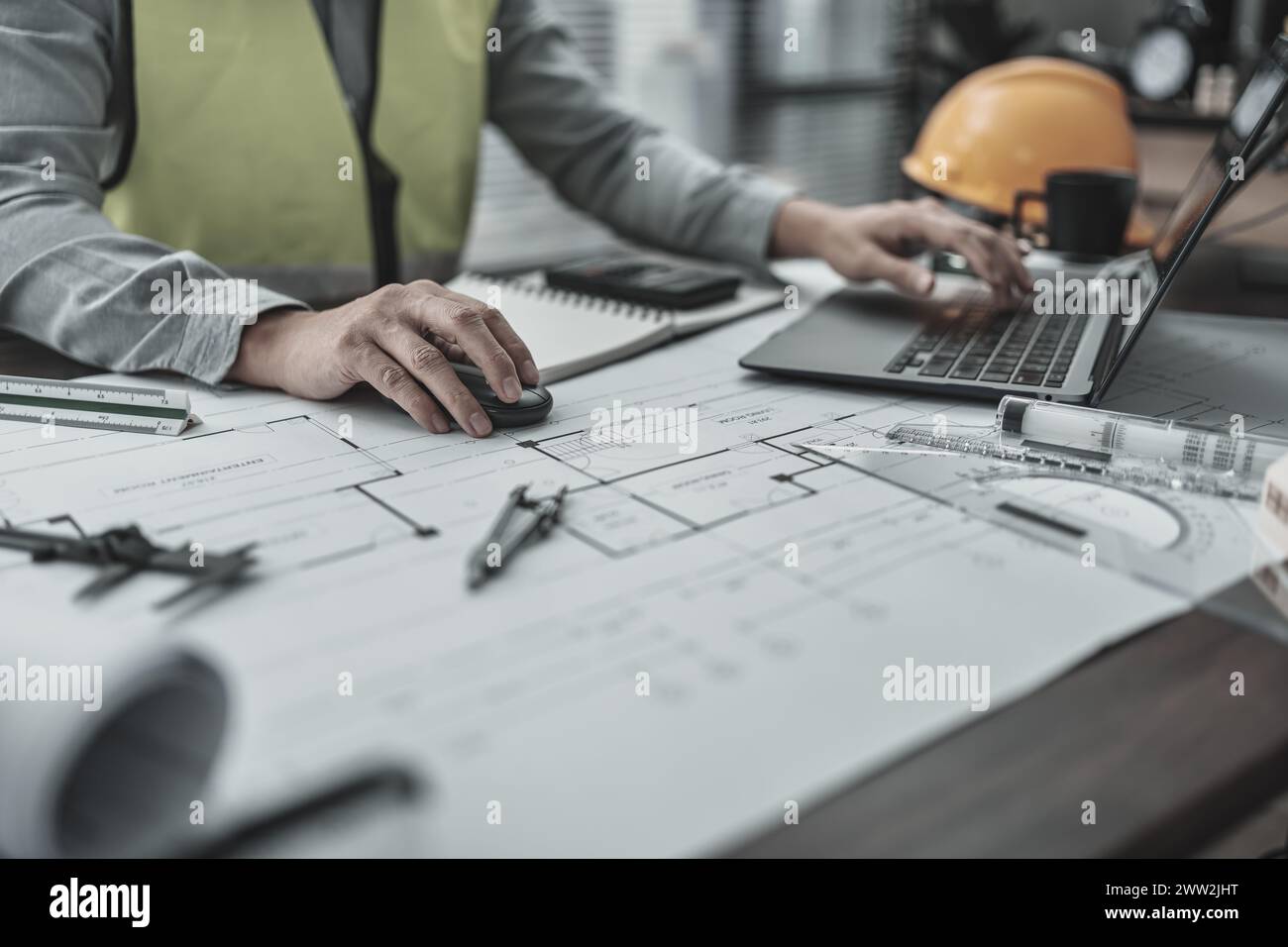 Architect working with laptop inspection on the office desk. Engineer ...