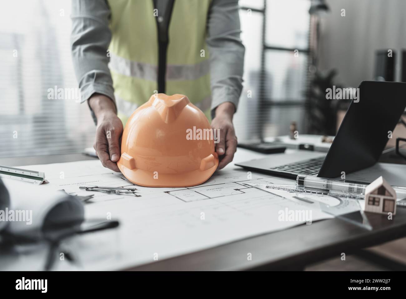 Engineering holding safety helmet with drawings inspection on the ...