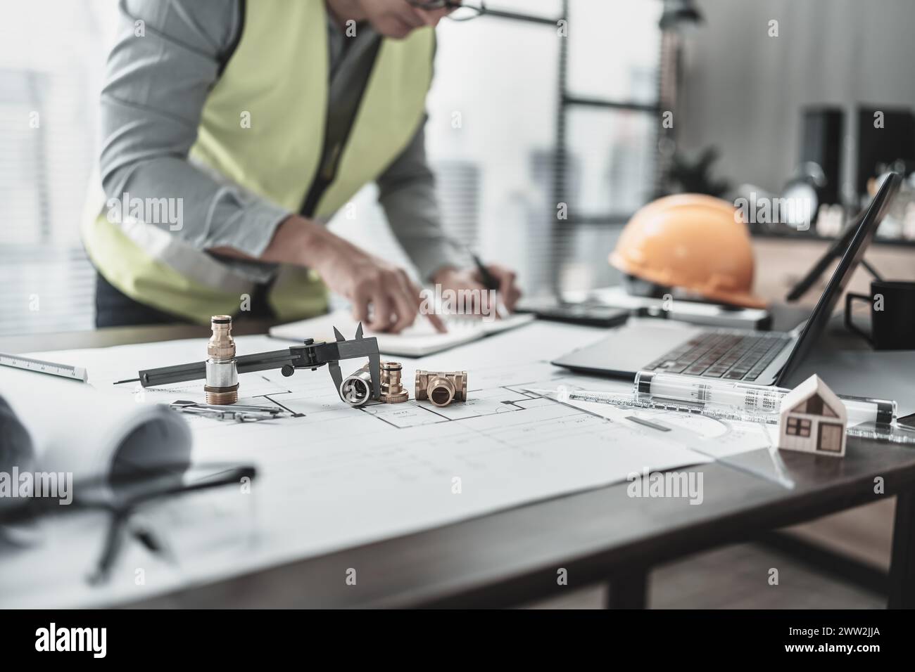 Engineering working with drawings inspection on the office desk safety ...