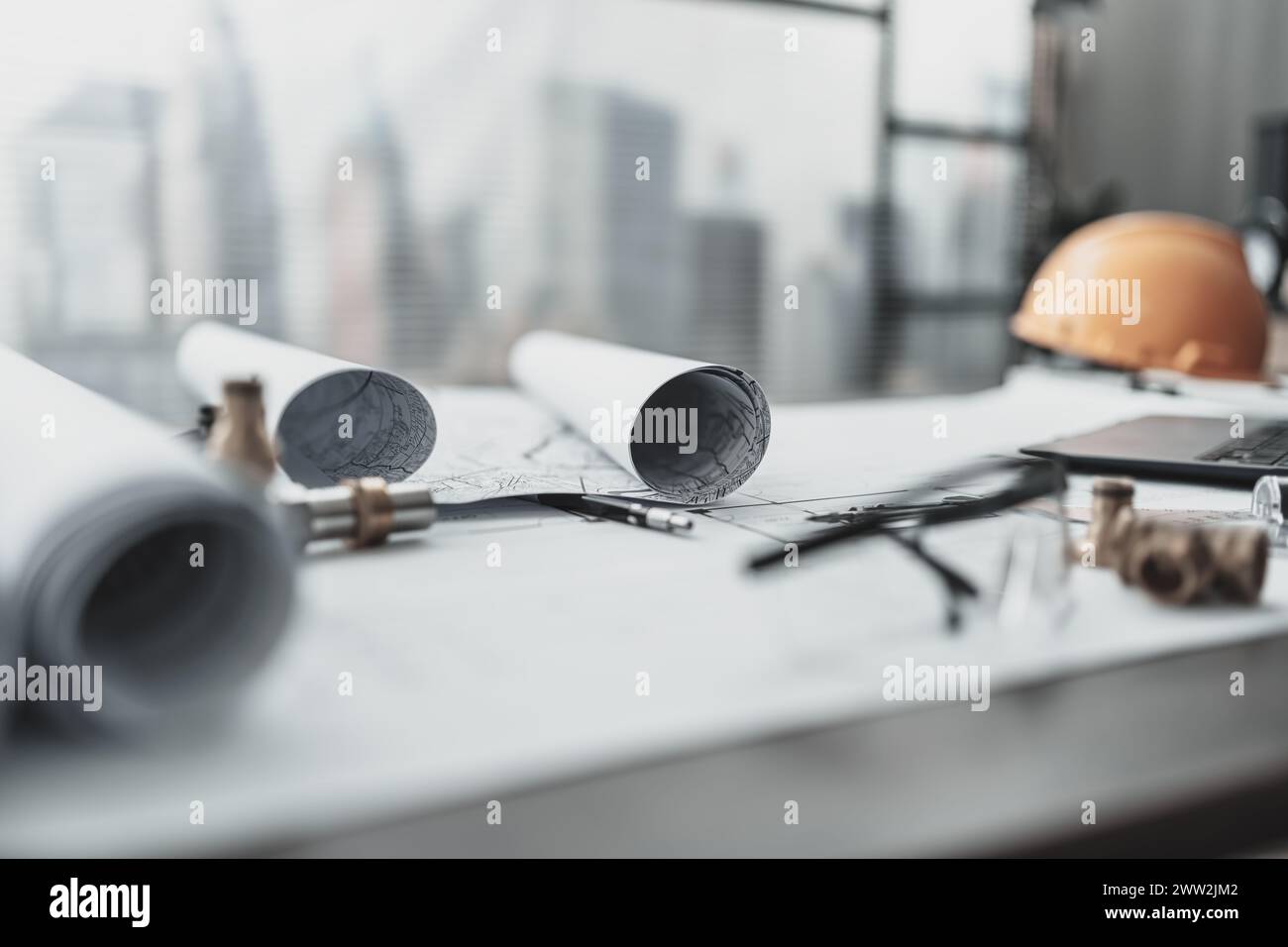 Architecture plans and city route map on engineer workplace Stock Photo ...