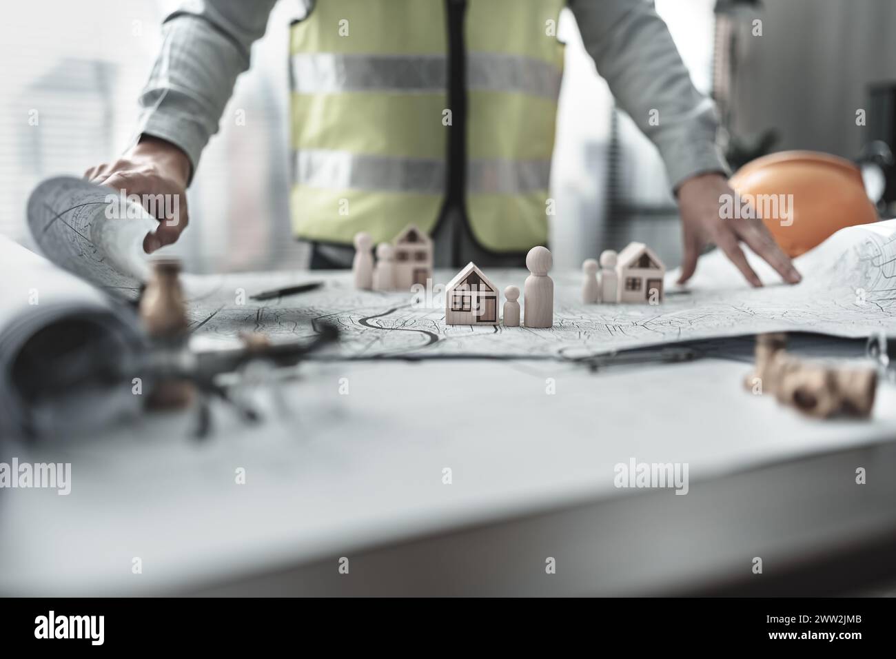 Model house and wood doll are repersent family on city map in front of ...