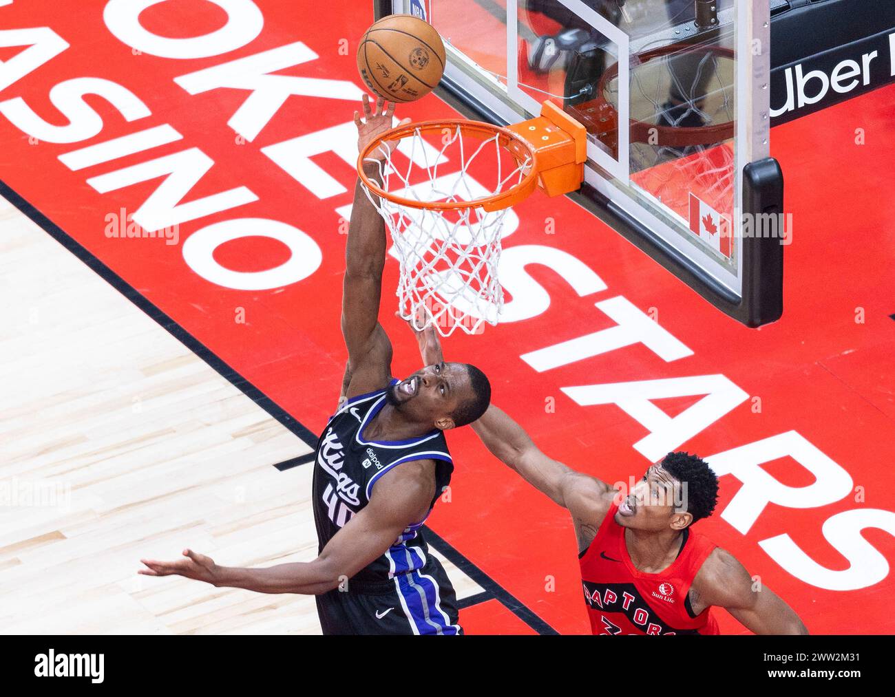 Toronto, Canada. 20th Mar, 2024. Harrison Barnes (L) of Sacramento ...