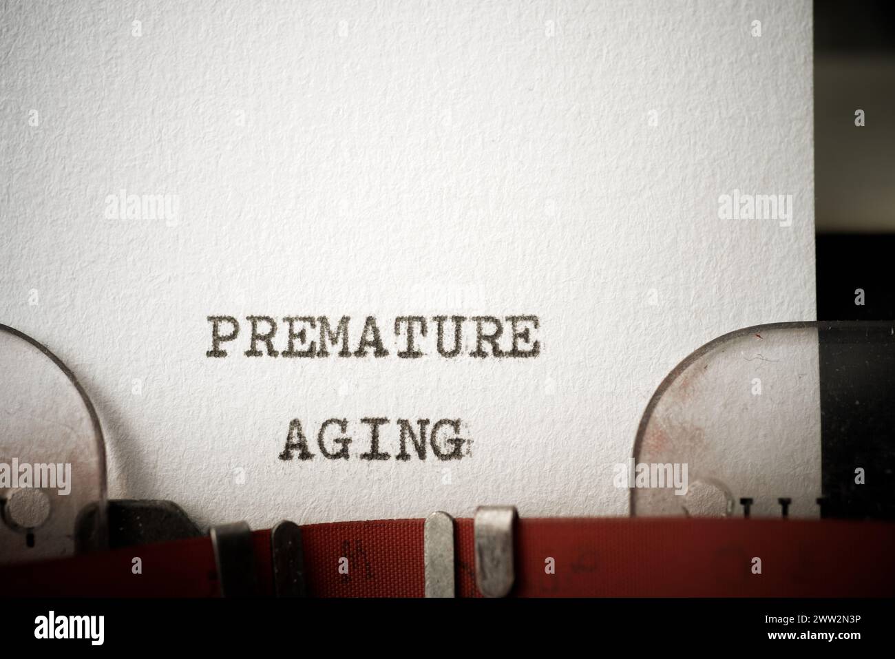 Premature aging text written with a typewriter Stock Photo - Alamy