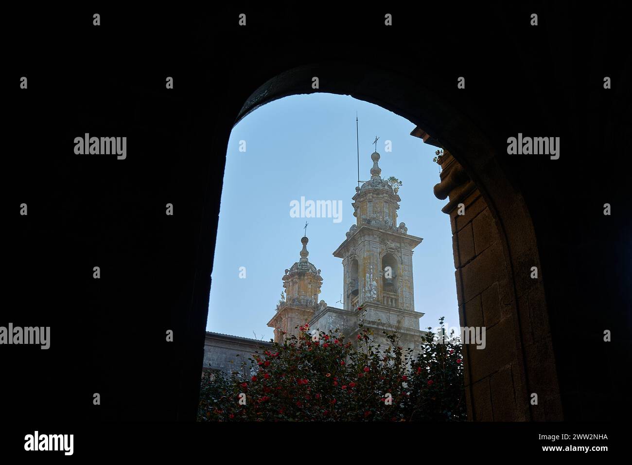 Towers of the Poio Monastery seen from an arch of the cloister in ...