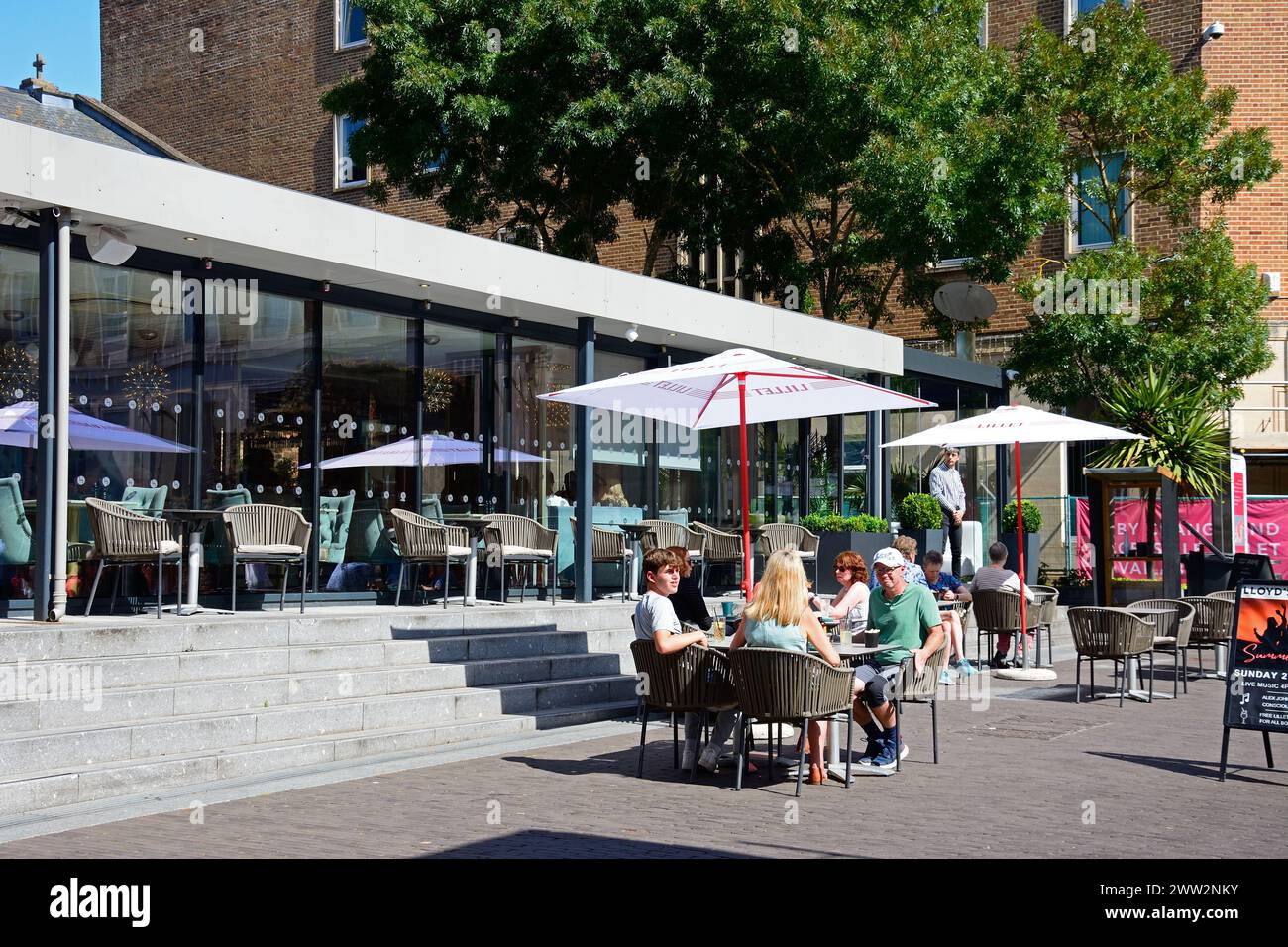 People relaxing at a pavement cafe along Catherine Street in the city ...