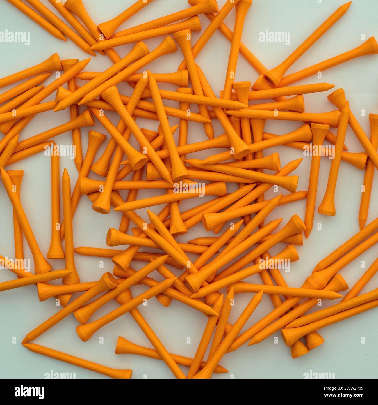 Orange Wooden Golf Tees on a white background Stock Photo - Alamy