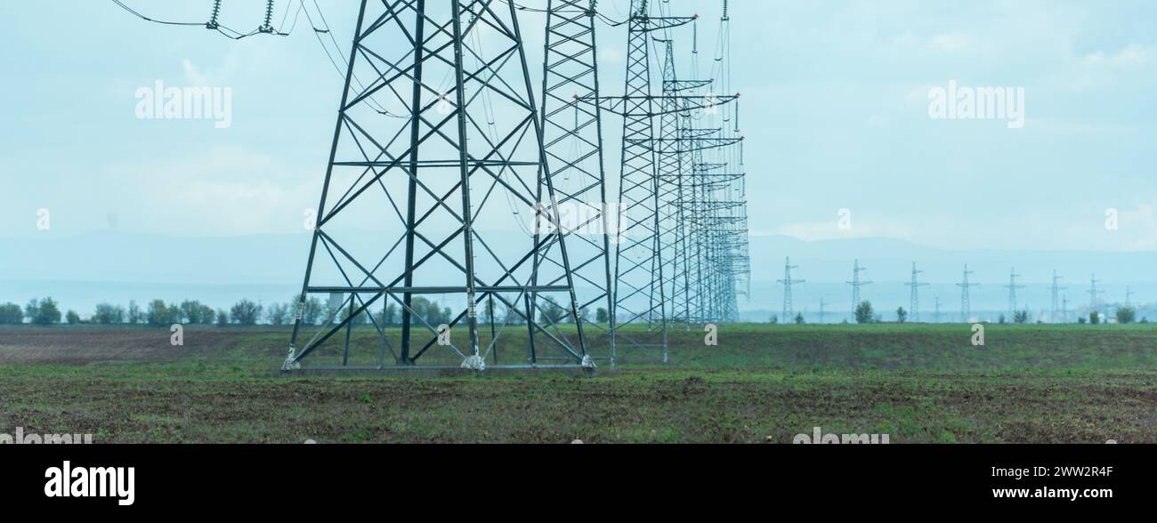 High voltage towers with sky background. Power line support with wires ...