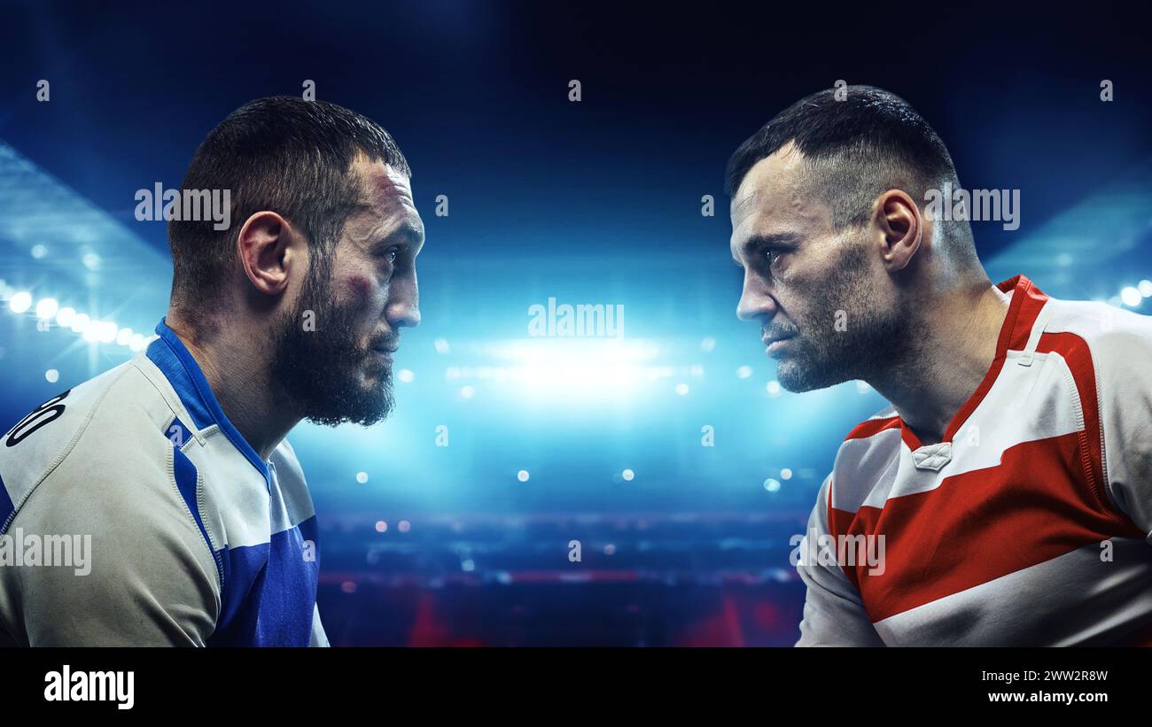 Two American football players standing closely and looking at each ...