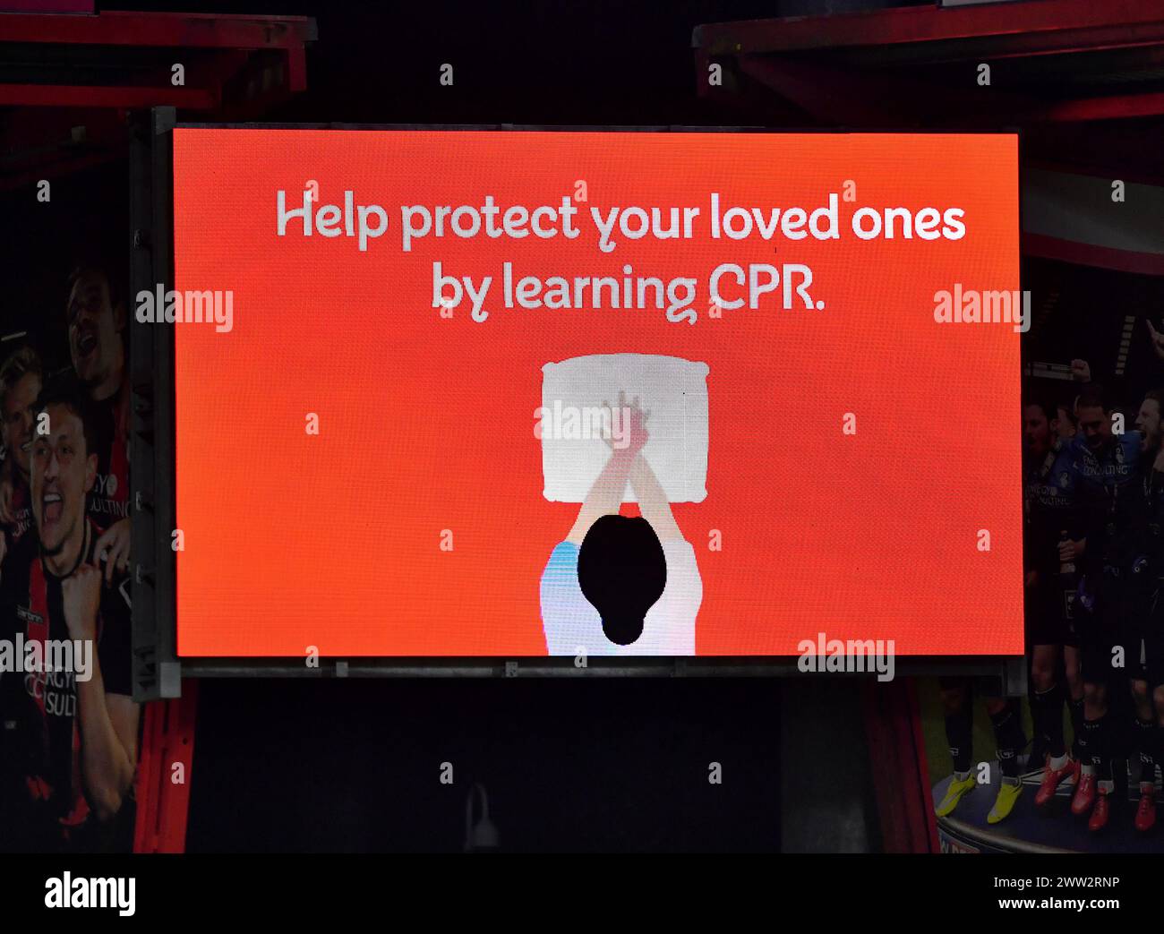 A sign is seen encouraging CPR training as the game is being replayed ...