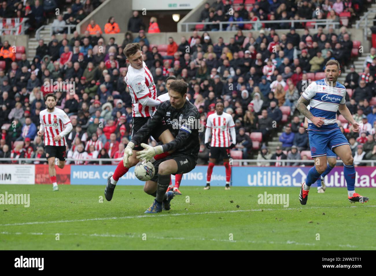 Chris Rigg of Sunderland collides with Asmir Begovic of Queens Park ...