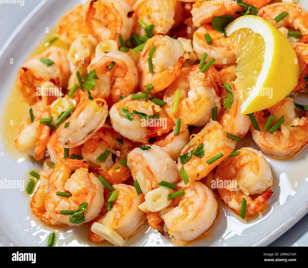 close-up of gambas al ajillo, easy spanish garlic shrimp are sauteed in ...
