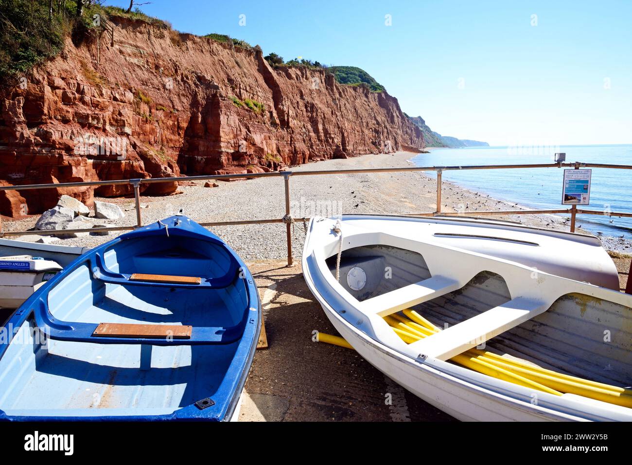 Boats moored alongside the beach with views of the beach and cliffs at ...