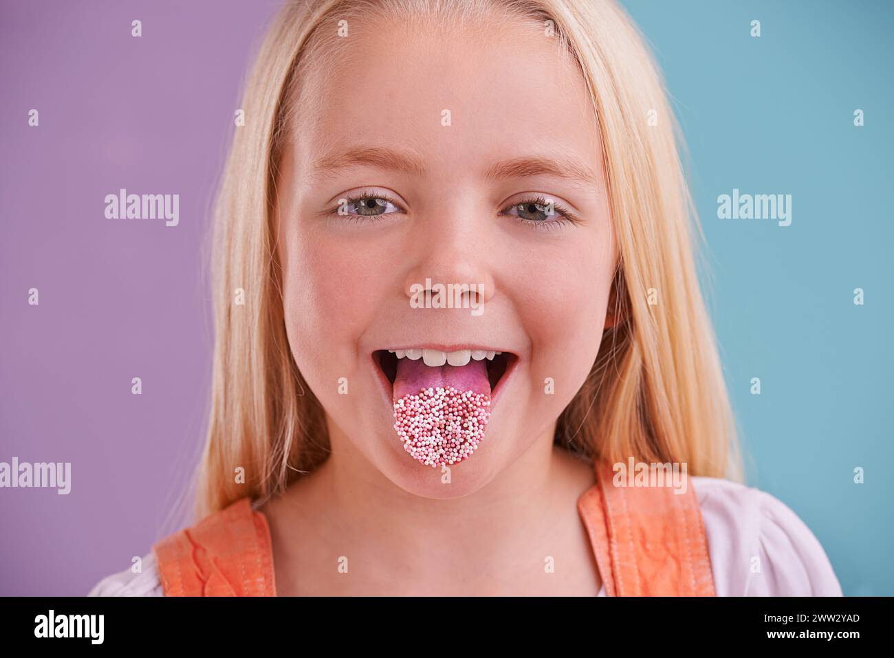 Child, portrait and tongue out in studio for crazy, silly and playful ...