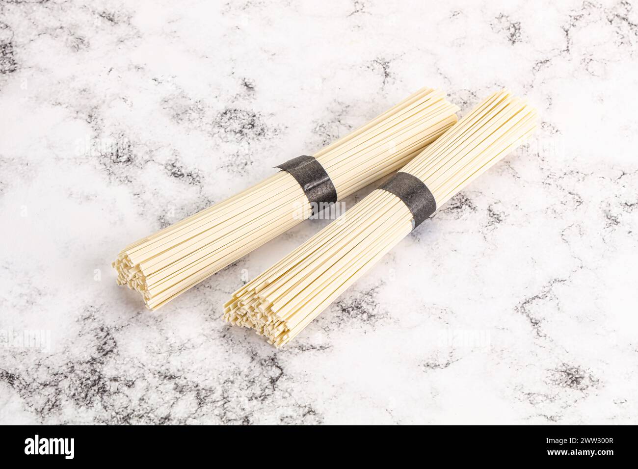 Raw asian udon wheat noodle for cooking Stock Photo - Alamy