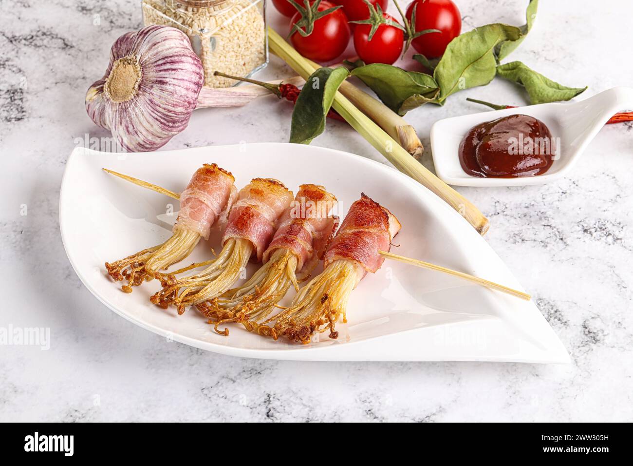 Tasty Grilled enoki mushroom with bacon Stock Photo - Alamy