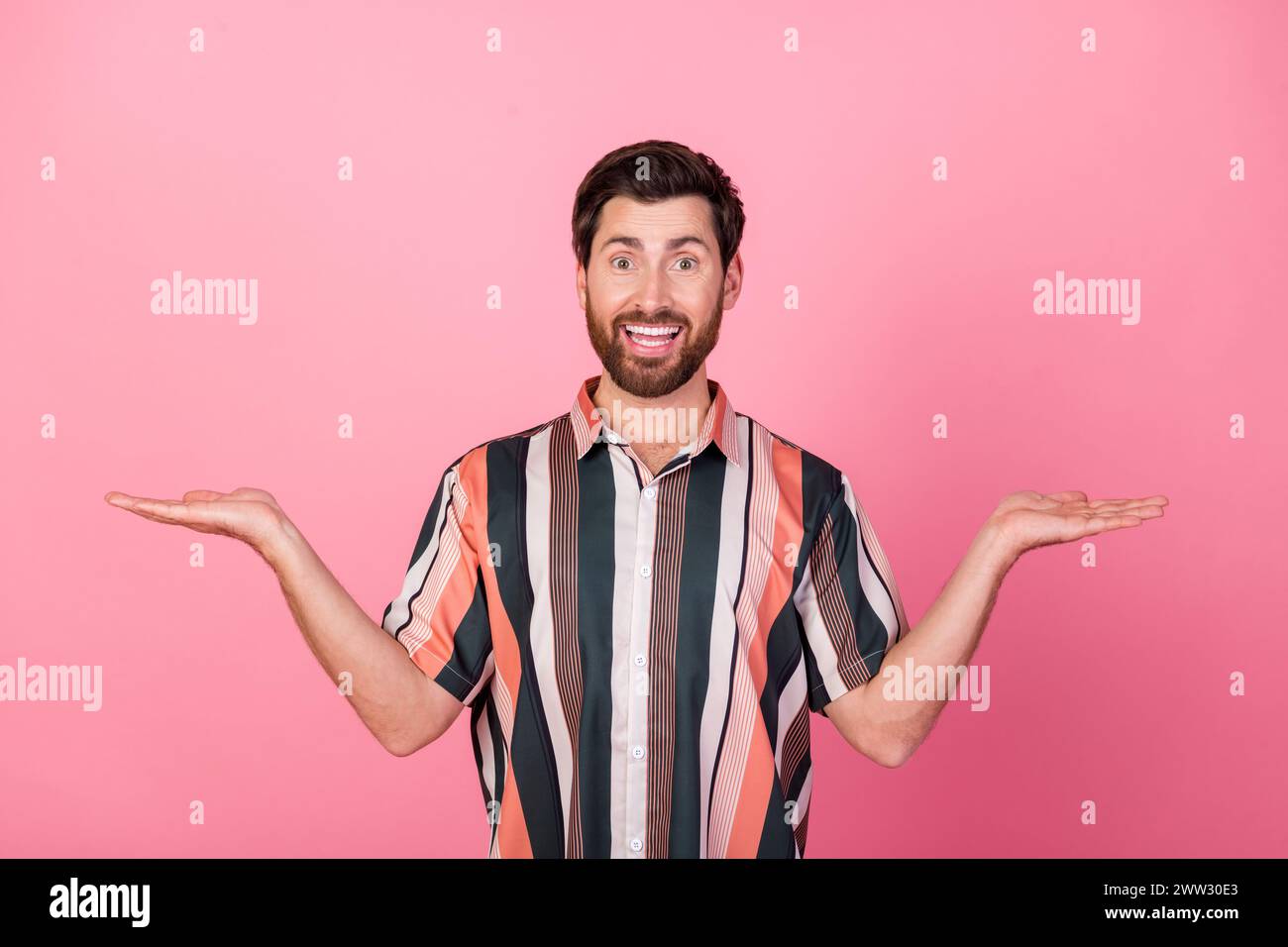 Photo of young guy funny expression promoting two hands recommend two ...